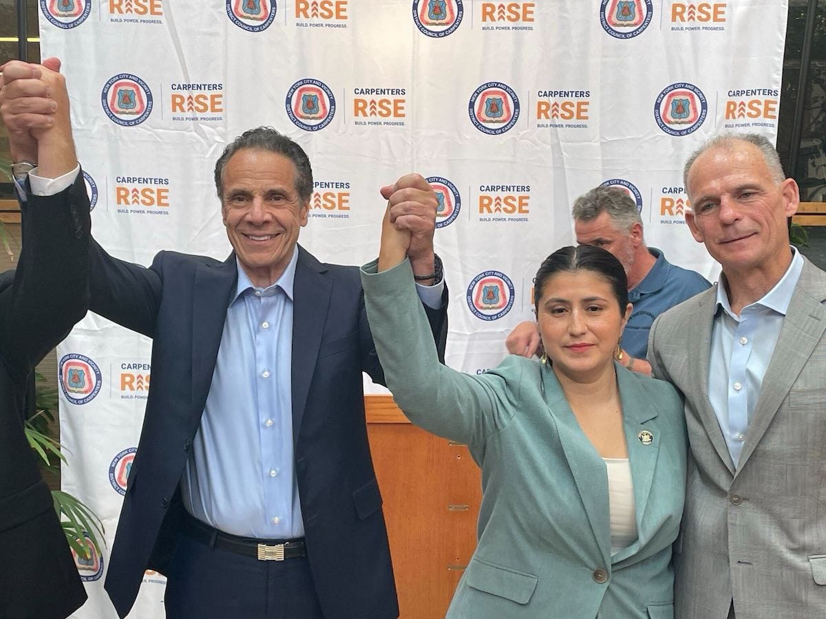 An Unsmiling Jessica Ramos Embraces Andrew Cuomo for Mayor of New York City